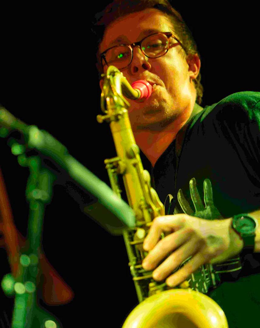 Alex Hitchcock plays Syos on his tenor saxophone