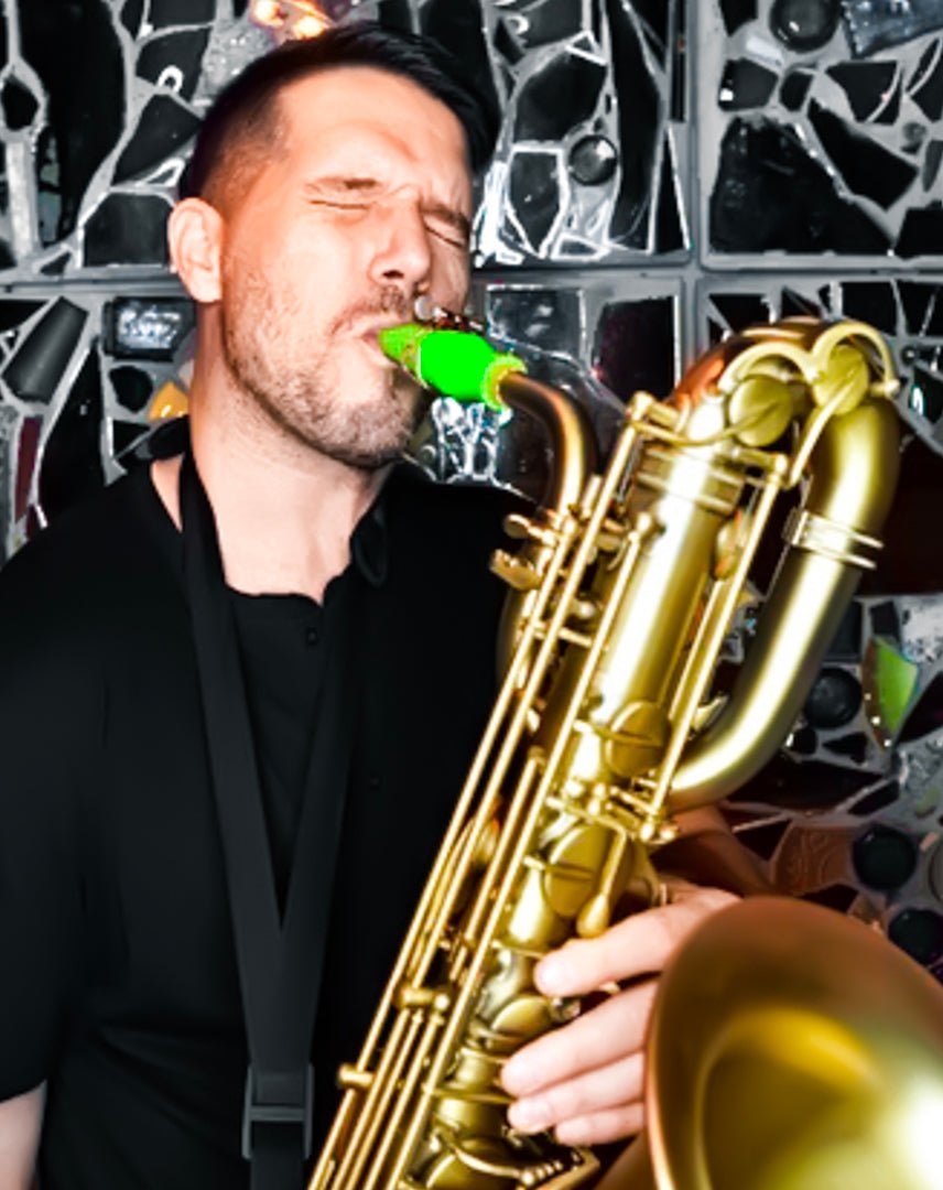 Scott Paddock plays Syos on his tenor saxophone